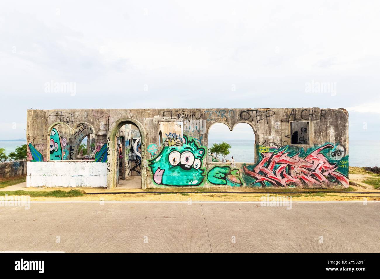 Ruined house covered in graffiti and street art, a popular tourist spot ...