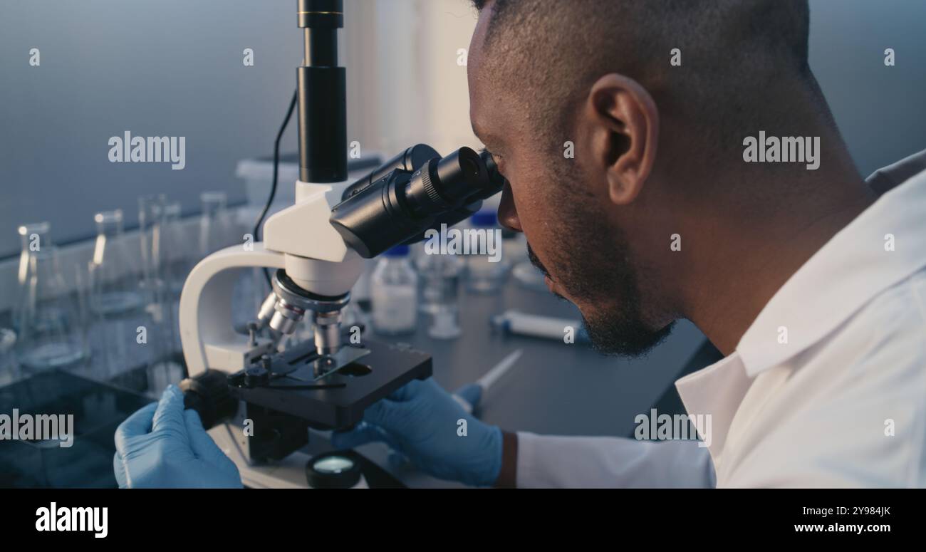 Medical laboratory: African American scientist analyzes molecular ...