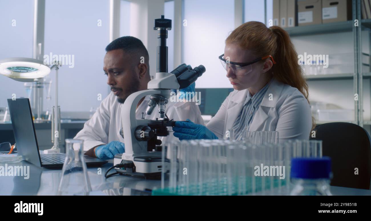 Diverse team of biotechnology scientists develop drugs in advanced ...