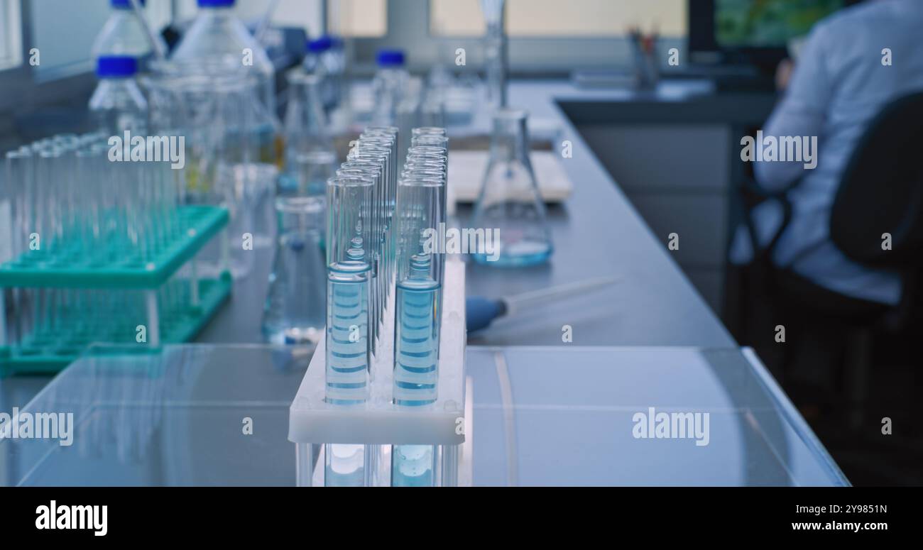 Medical science lab: Close up of chemist or scientist taking blue ...