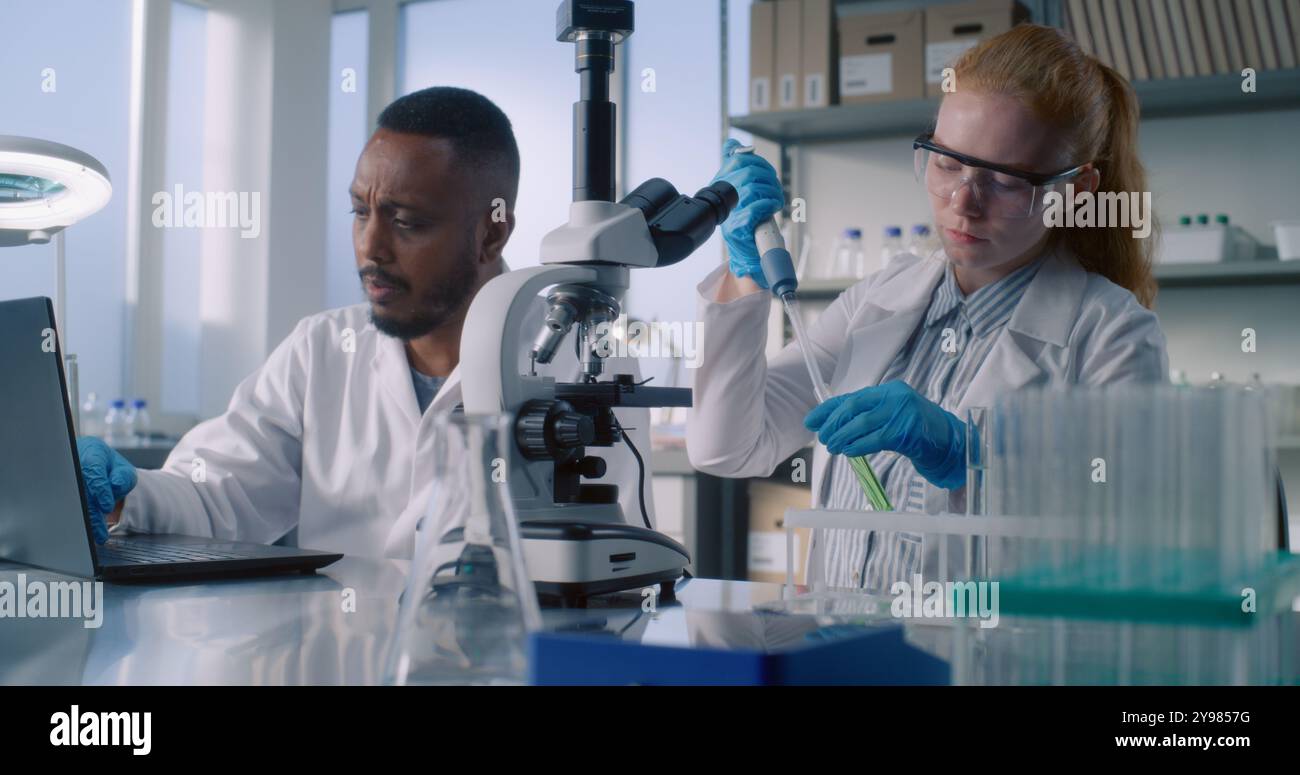 Multiethnic team of biotechnology scientists develop drugs in advanced ...