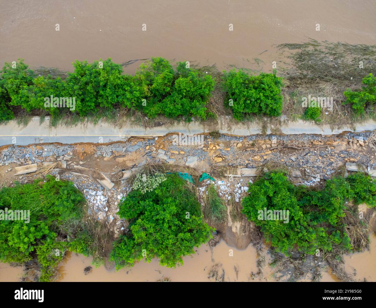Landslides caused by heavy rains have caused the asphalt roads to crack ...