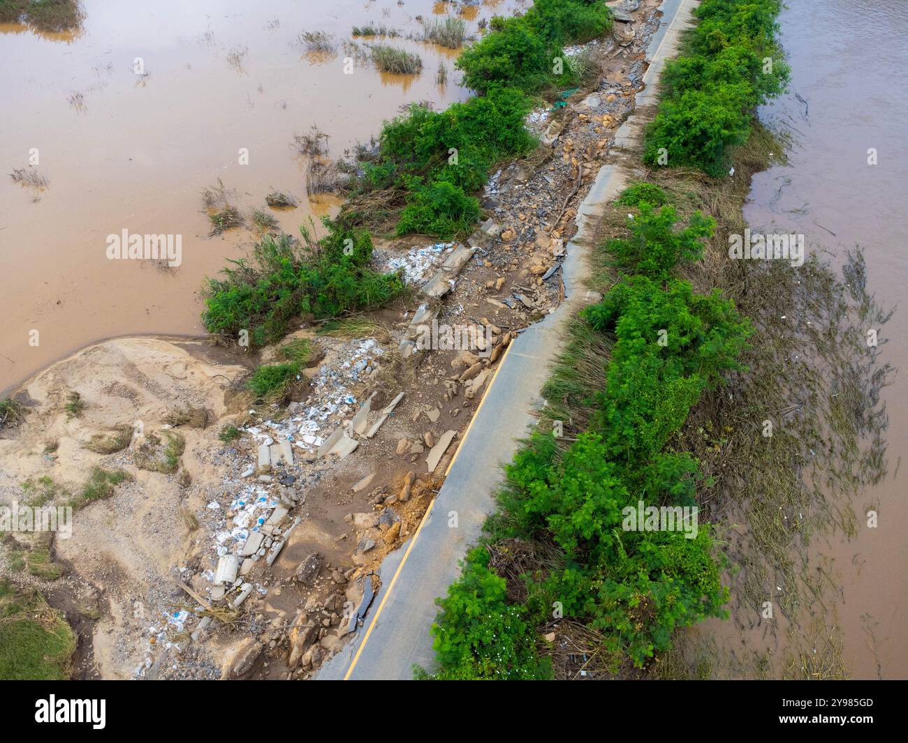Landslides caused by heavy rains have caused the asphalt roads to crack ...