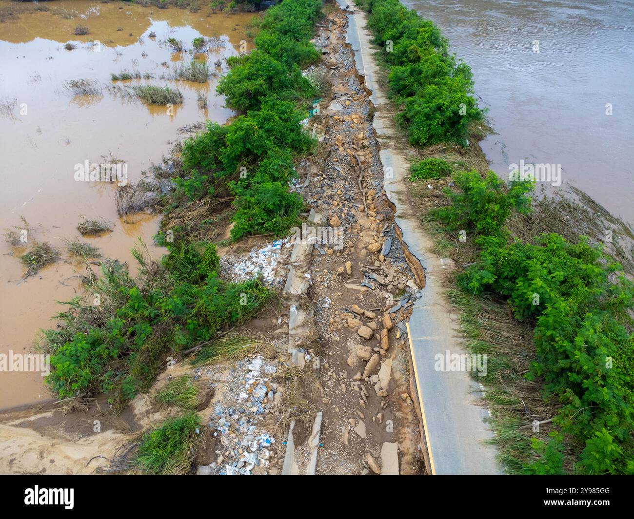 Landslides caused by heavy rains have caused the asphalt roads to crack ...