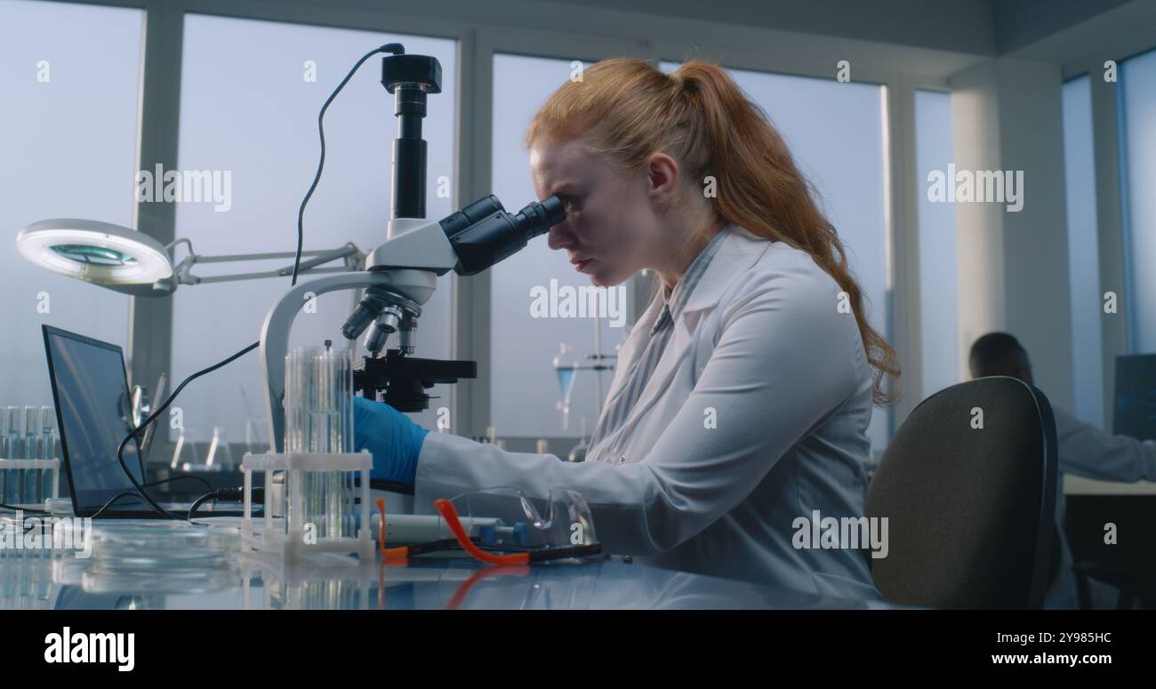 Bright medical science laboratory: Professional microbiologist uses ...