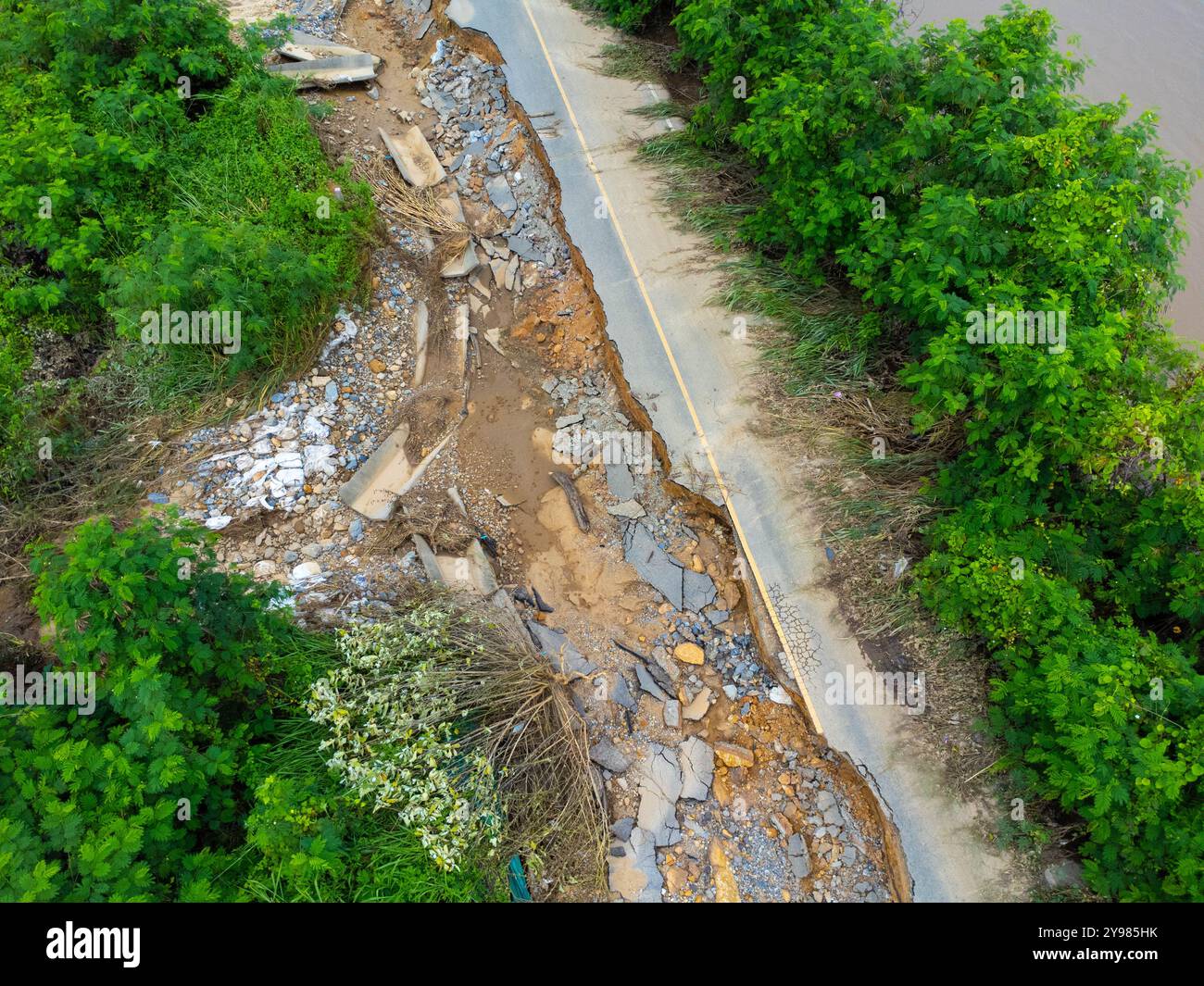 Landslides caused by heavy rains have caused the asphalt roads to crack ...