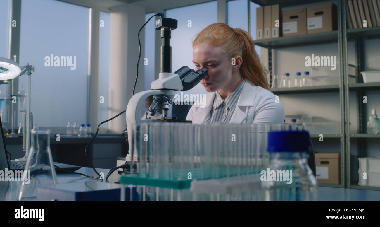 Bright medical science laboratory: Professional microbiologist uses ...