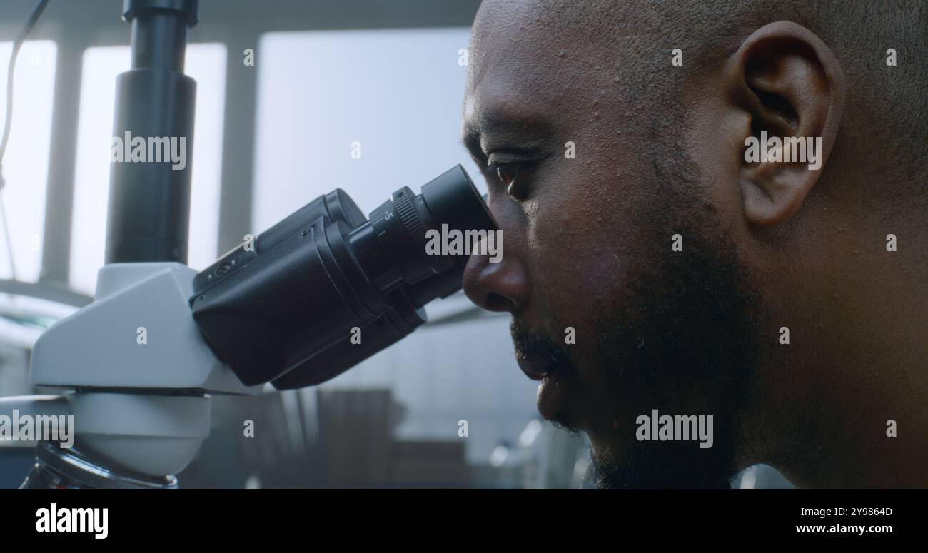 Medical science laboratory: Close up of African American male ...