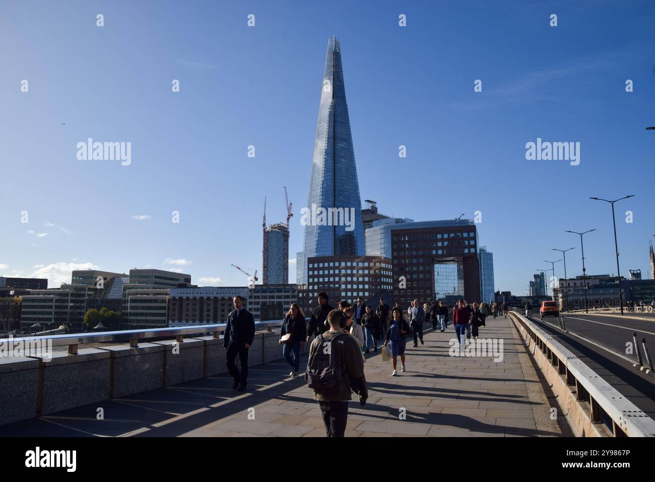 London, UK. 11th September 2024. People walk along London Bridge past ...