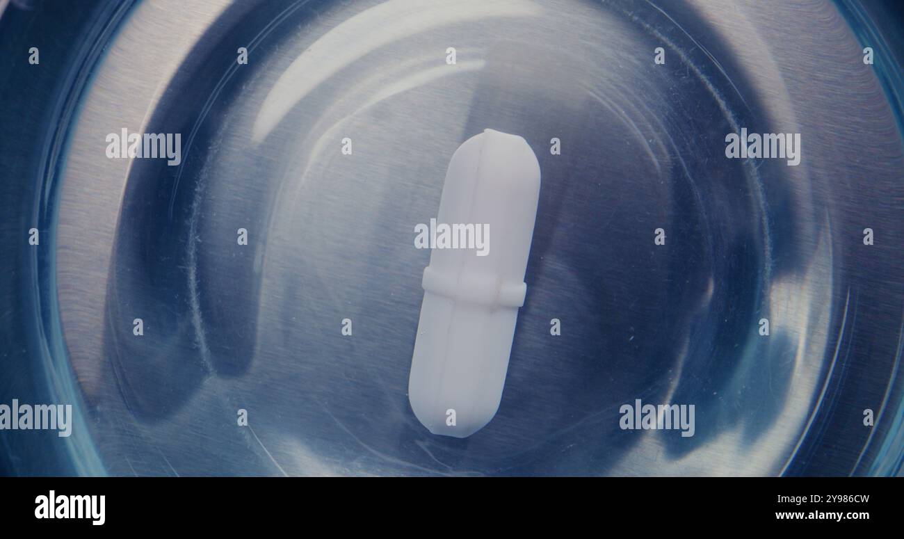 Medical science laboratory with modern equipment: Chemist adds liquid ...