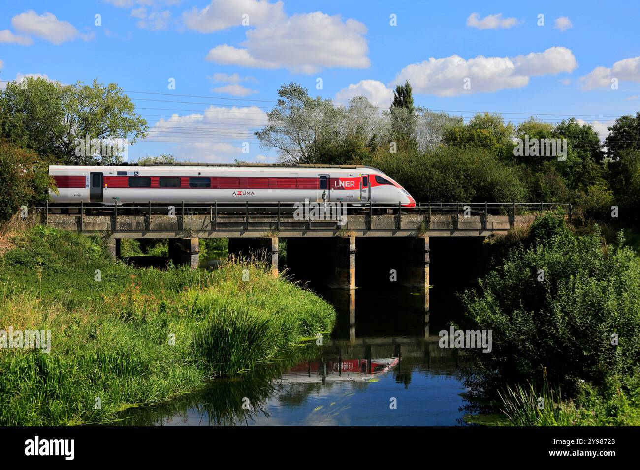 LNER Azuma train crossing a river bridge, East Coast Main Line Railway ...