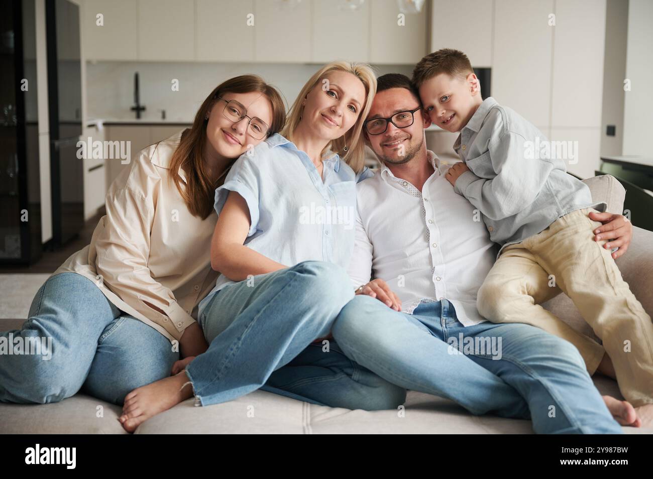 Lovely portrait of family chilling together at home. Big family lying ...