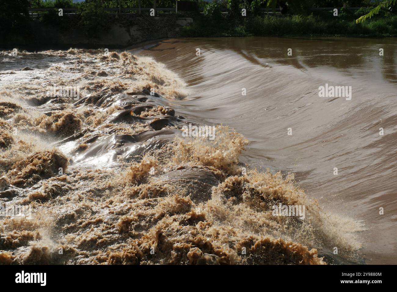 Flash floods flow from the mountains into the Ping River Stock Photo ...