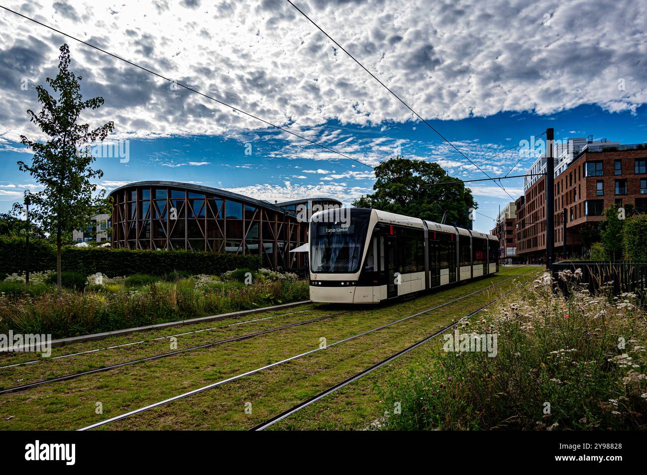 Odense light train passing through city centre by the H.C. Andersen ...