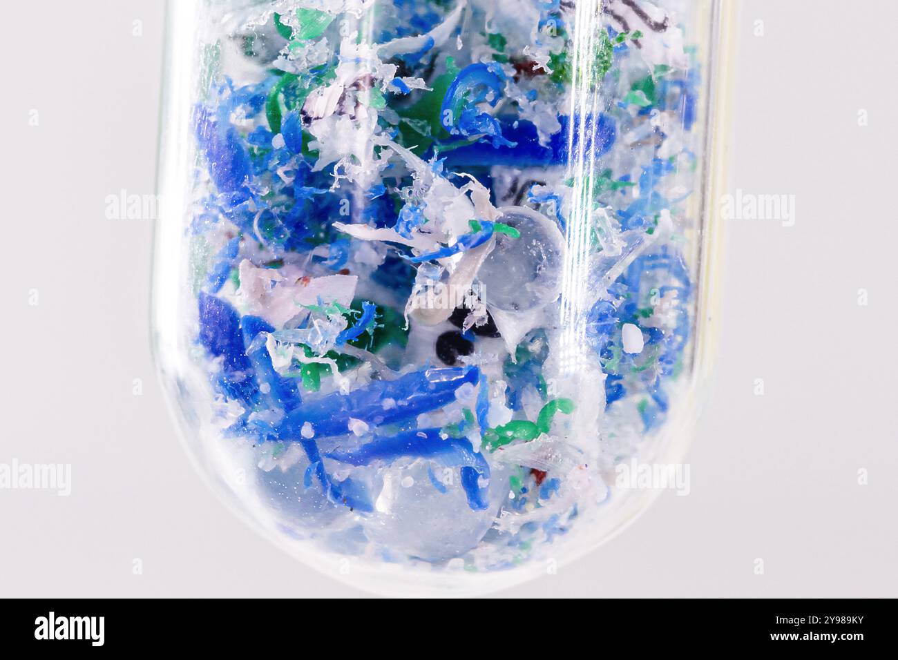 close-up of test tube with traces of plastic and micro plastic taken ...