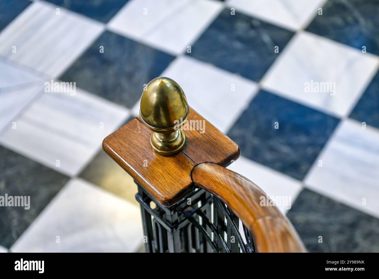 Ancient handrail in the staircase of a colonial building’s interior ...