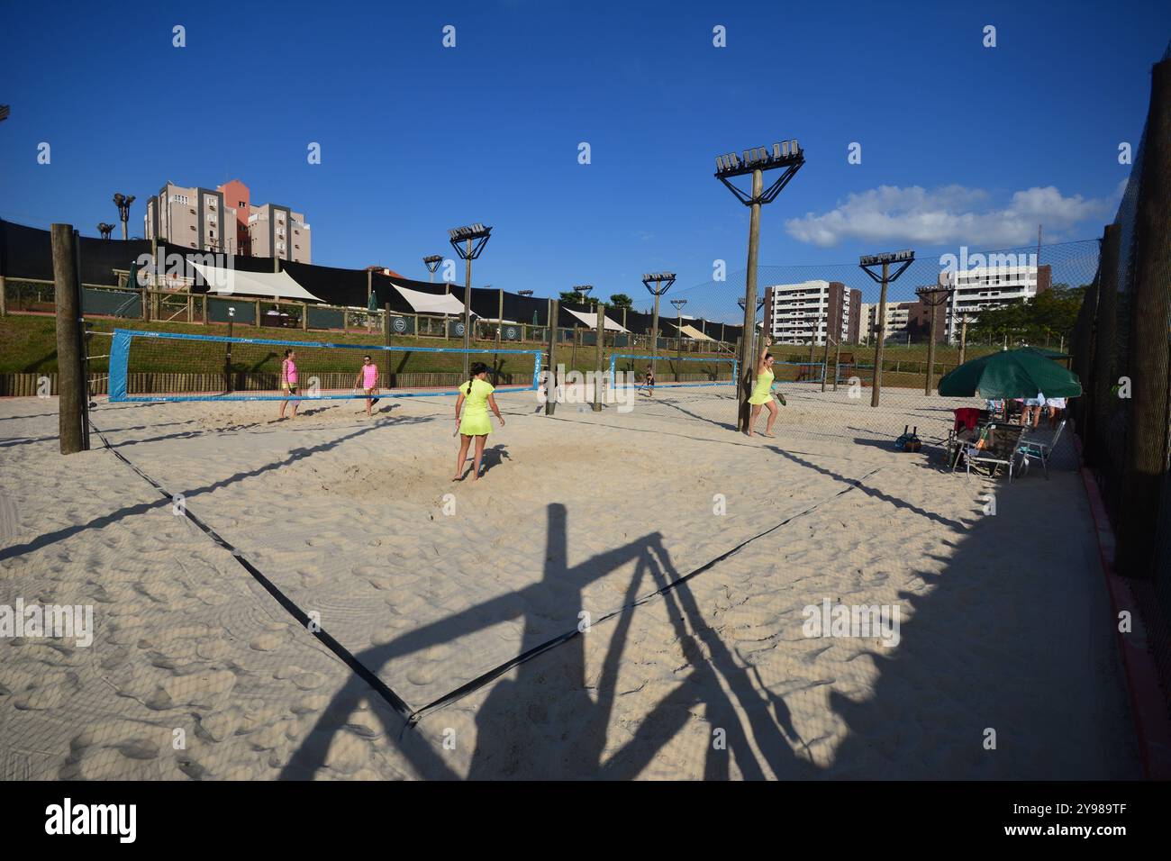 Athletes playing in beach tennis competition Stock Photo - Alamy