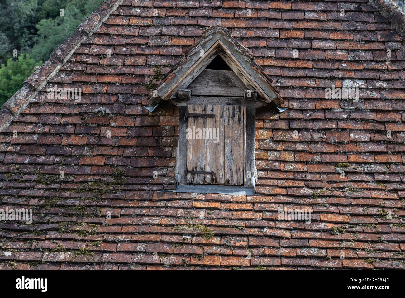 Shuttered dormer window with terracotta roof tiles, Saint-Cirq-Lapopie ...
