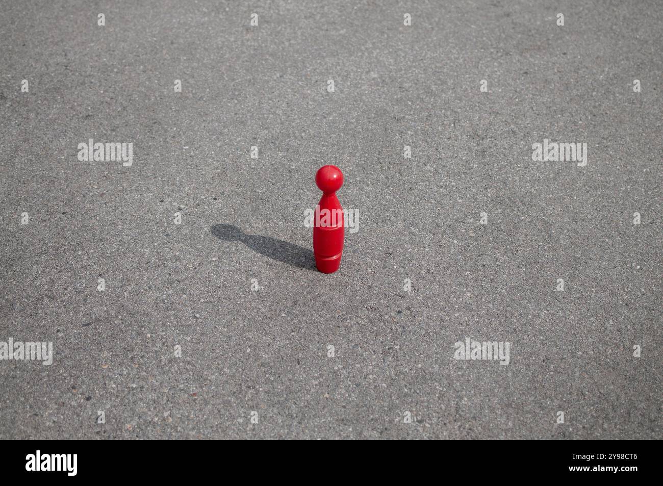 Red plastic skittle used by children to play Stock Photo - Alamy