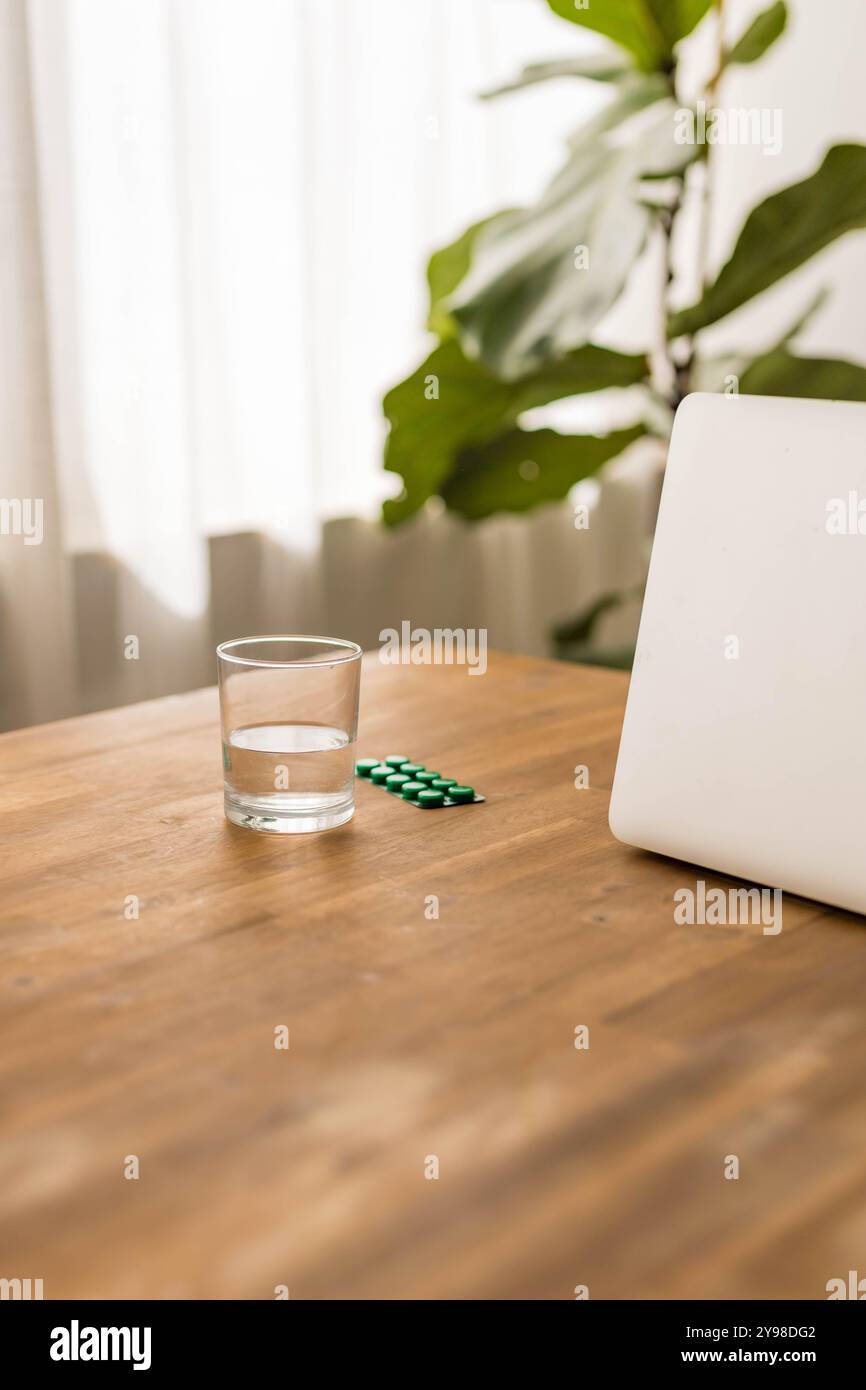 pill packet and a glass of water on the table. High quality photo Stock ...