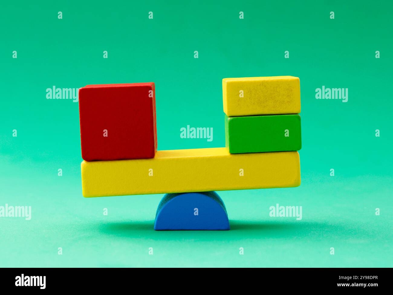 Colorful different geometric figures in balance Stock Photo - Alamy
