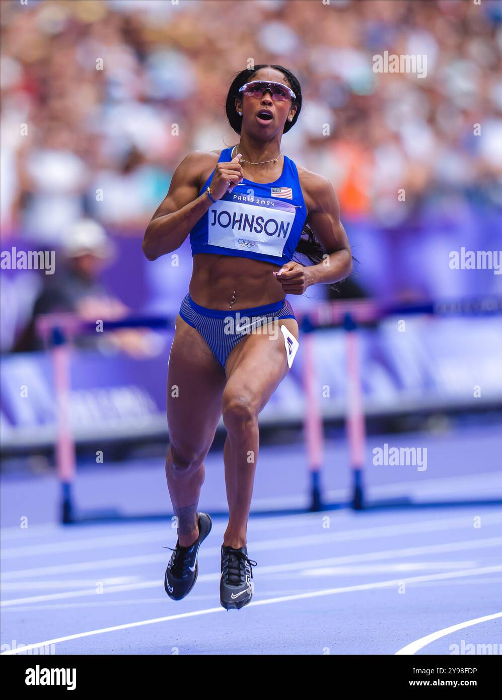 Alaysha Johnson participating in the 100 meters hurdles at the Paris ...