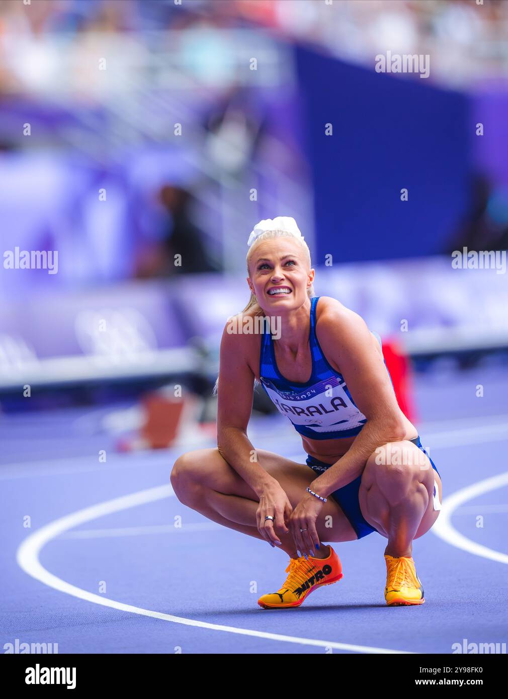 Lotta Harala participating in the 100 meters hurdles at the Paris 2024 ...