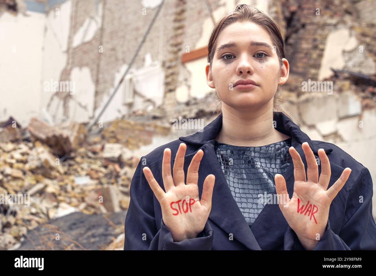 Slogan of peace without war is written on the woman's hand in red stop ...