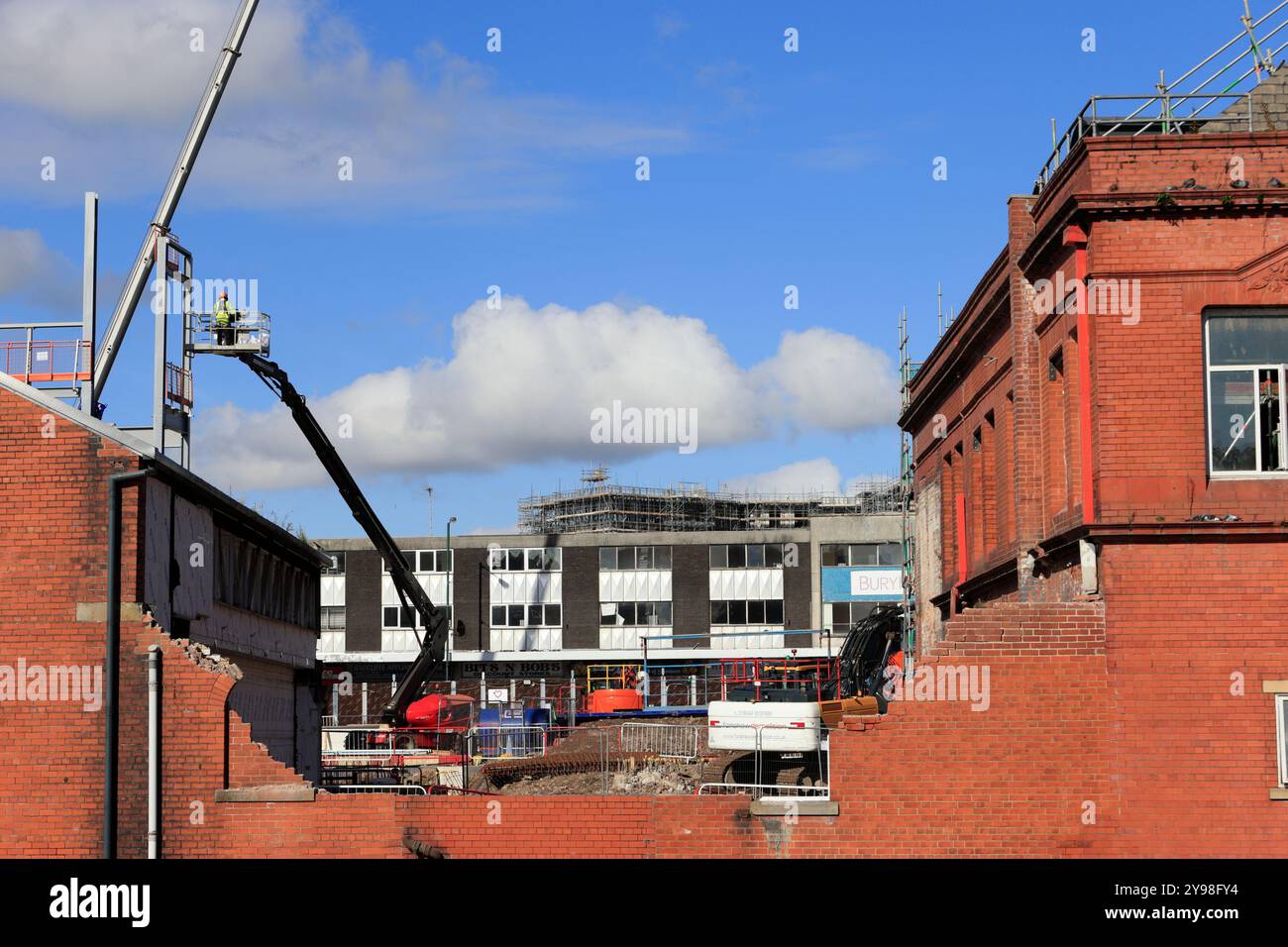 Construction site, workman working at height, view across the river ...