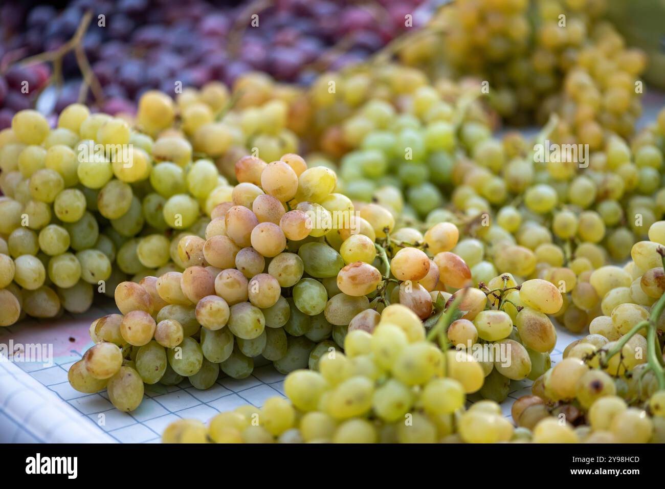 grapes displayed on a farmer's market counter Stock Photo - Alamy
