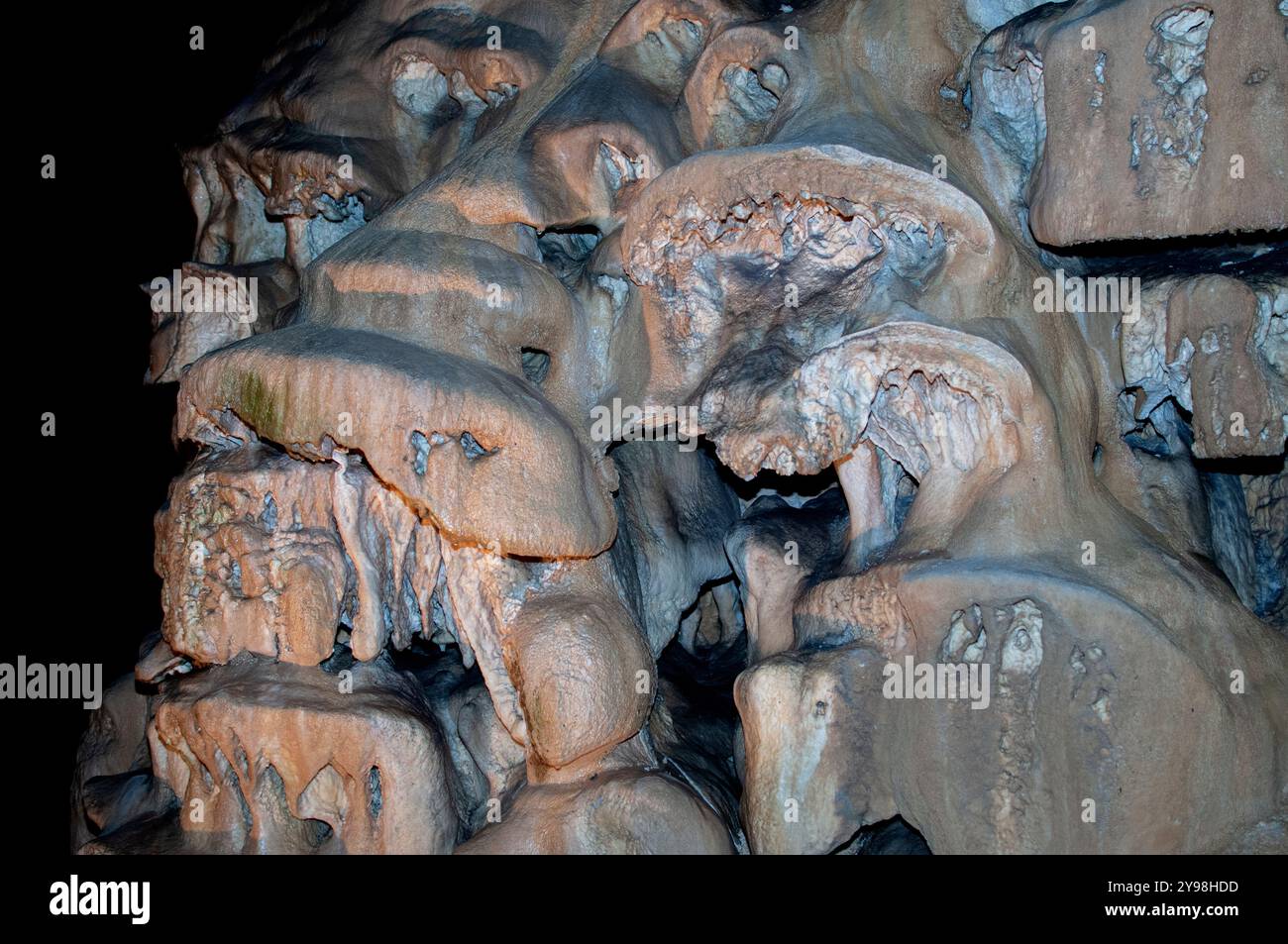 Closeup of limestone formations of stalactites and stalagmites inside a ...