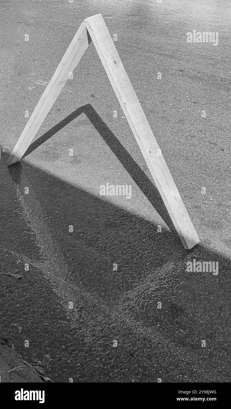 Triangle Reflection of Wooden Planks on Wet Street – Parking Spot ...