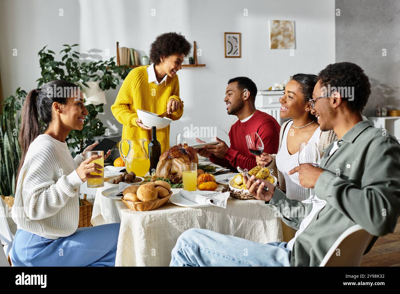 Close friends gather around a table to share a festive Thanksgiving ...