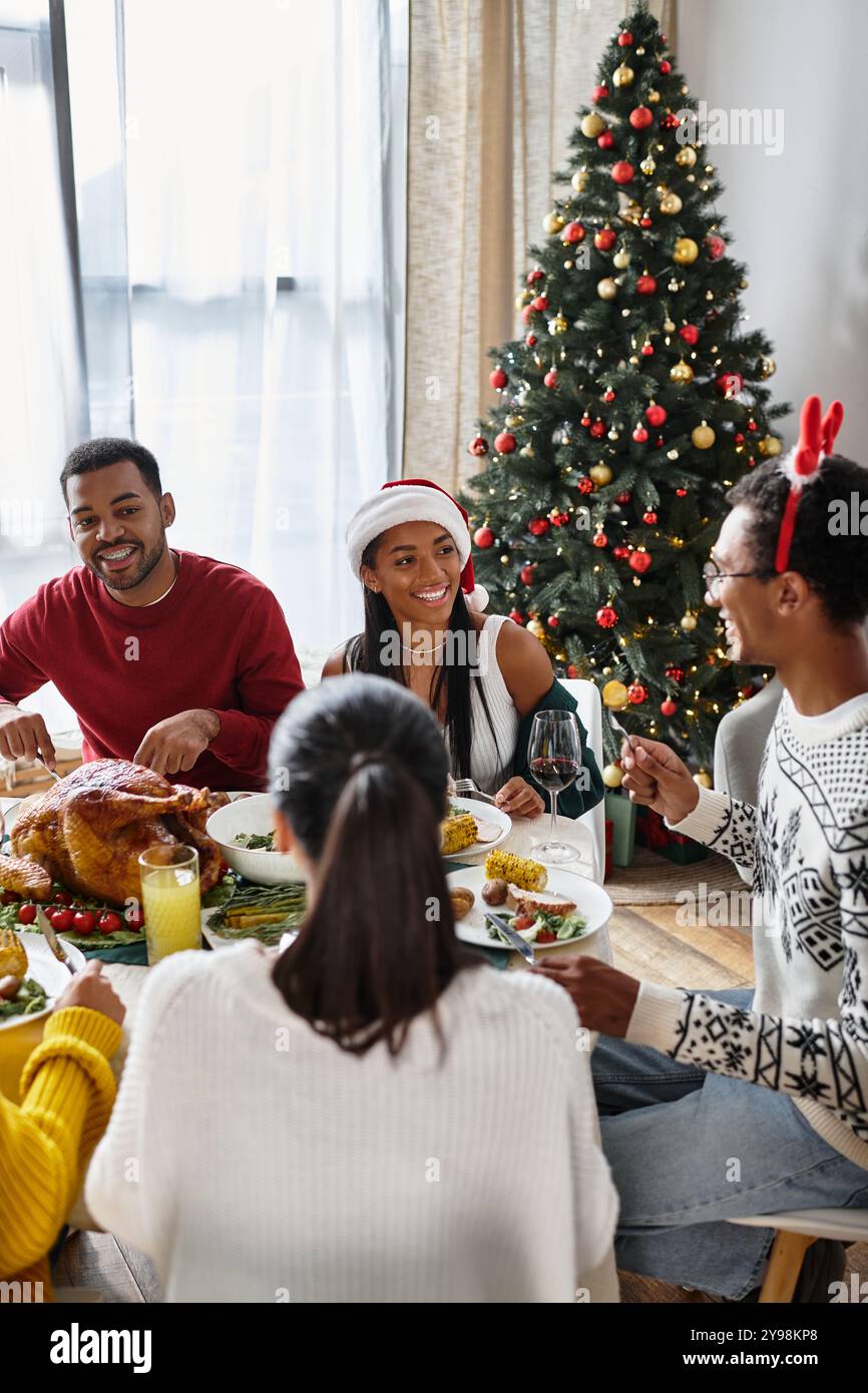 A group of friends shares a joyful Christmas dinner, surrounded by ...