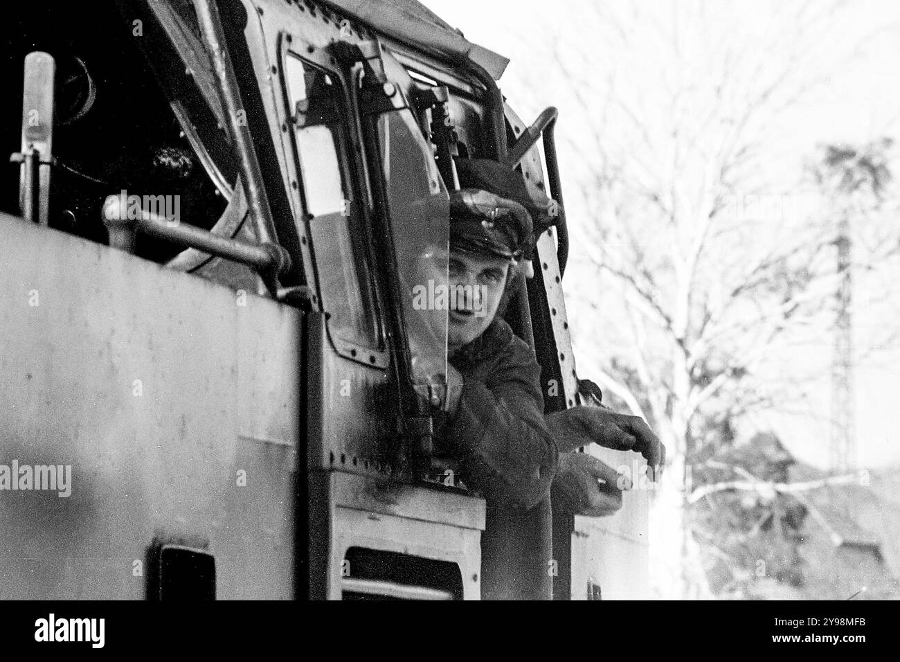 An engine driver with a narrow gauge steam locomotive at Gernrode in ...