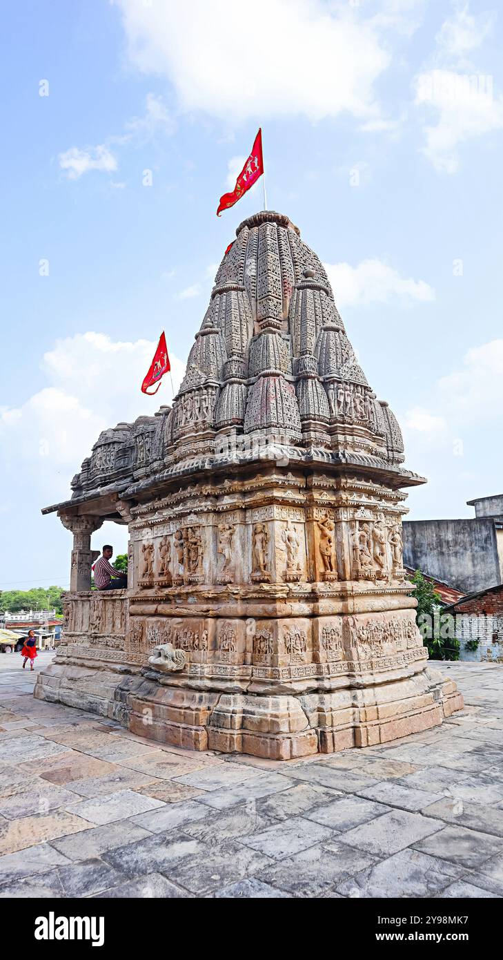 Side wide view of Malai Mata Temple with carved panel of Hindu deities ...