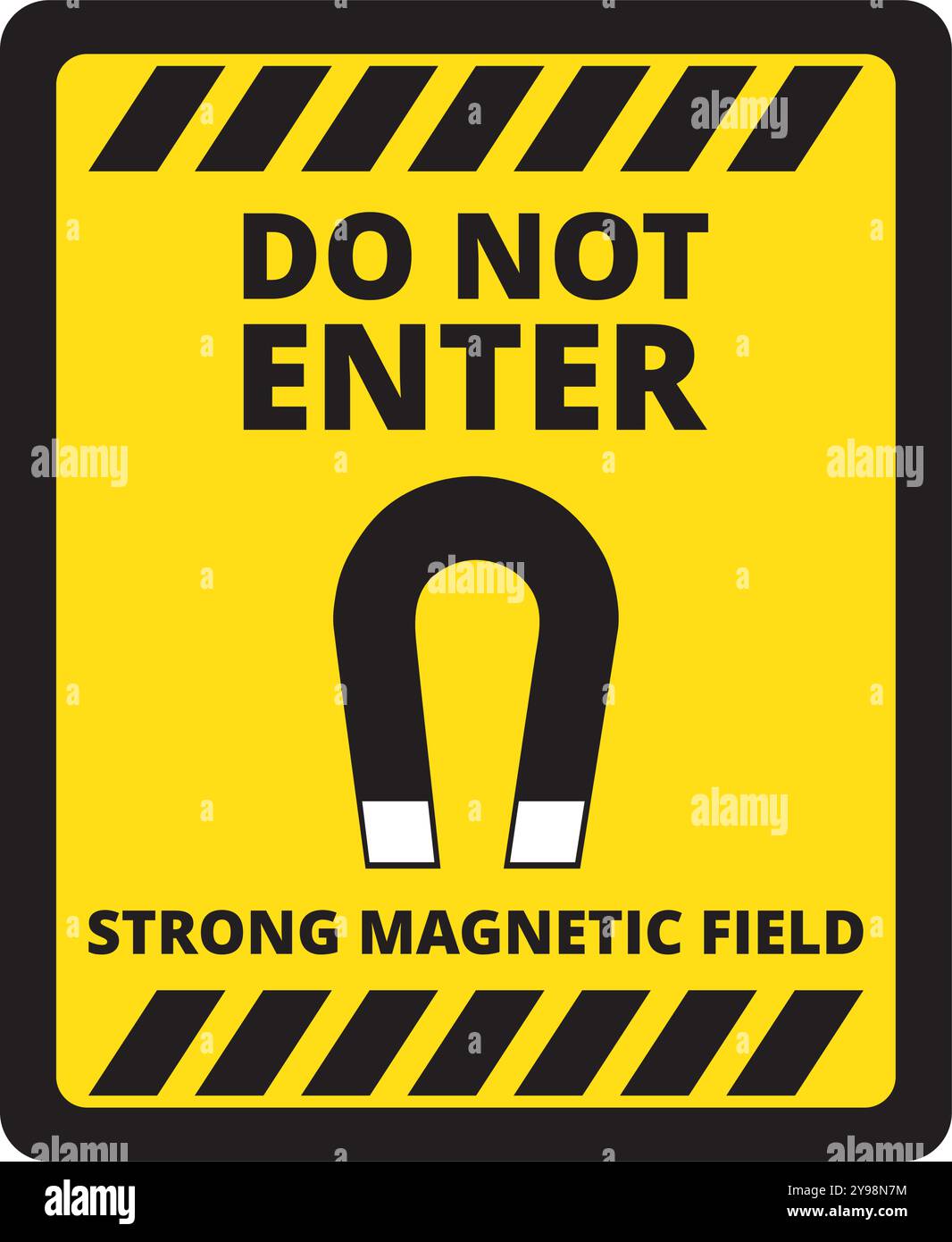 Yellow and black magnetic field warning sign on a white background ...