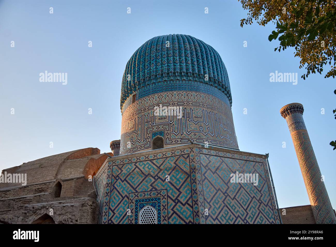 Stunning blue dome and towering minaret of the Gur-e-Amir Mausoleum ...