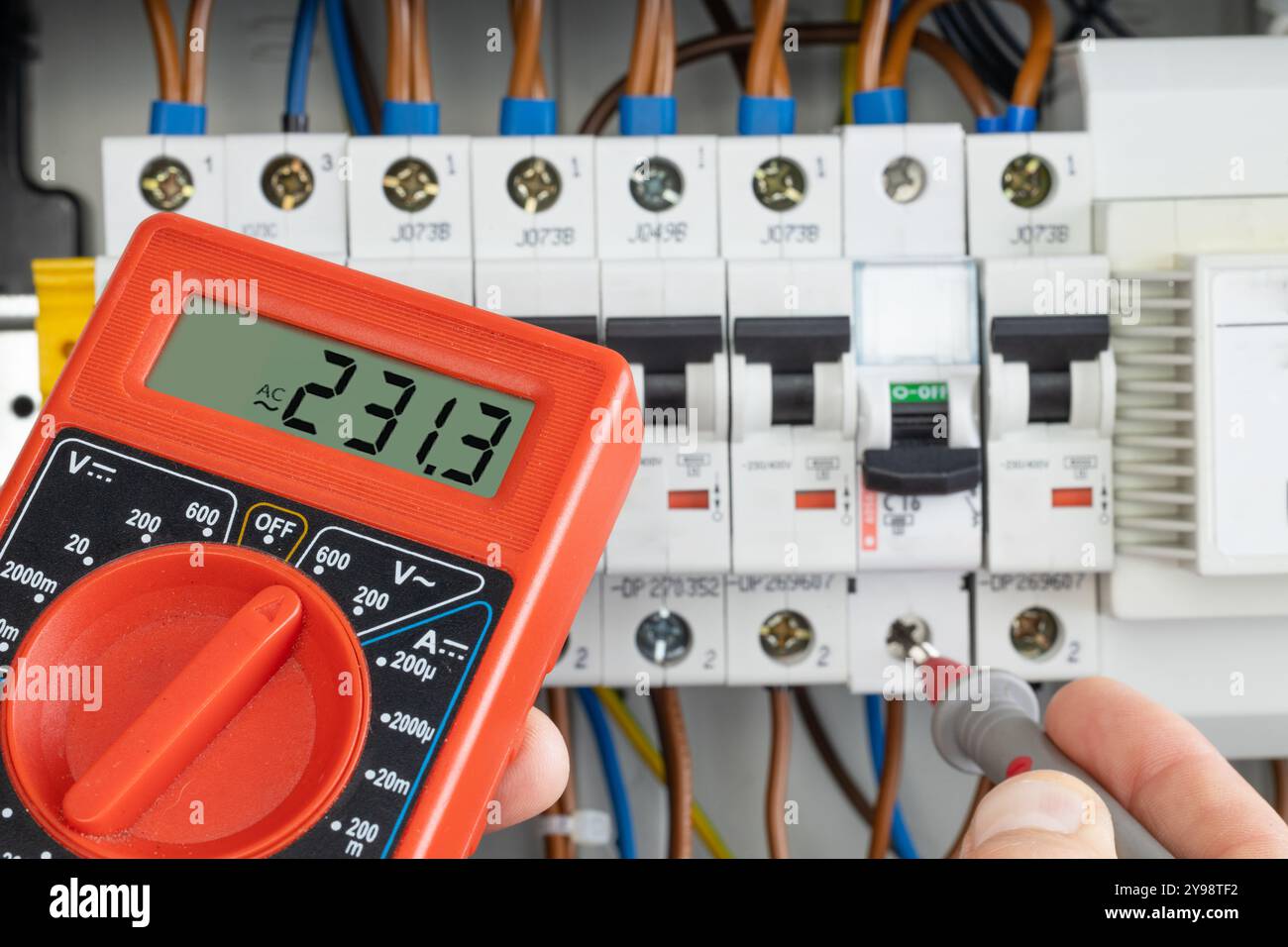 Hand Testing Electrical Circuit with Multimeter Stock Photo - Alamy