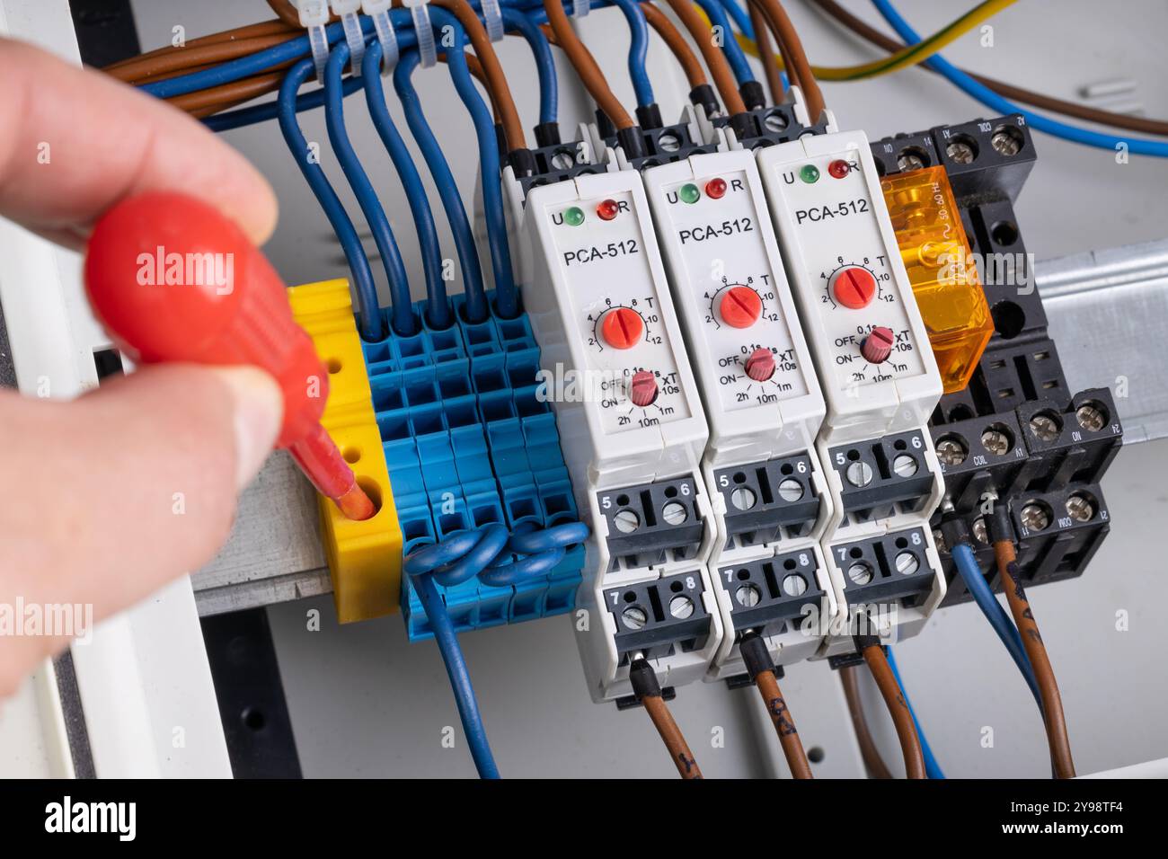 Technician Connecting Wires in Electrical Control Panel Stock Photo - Alamy
