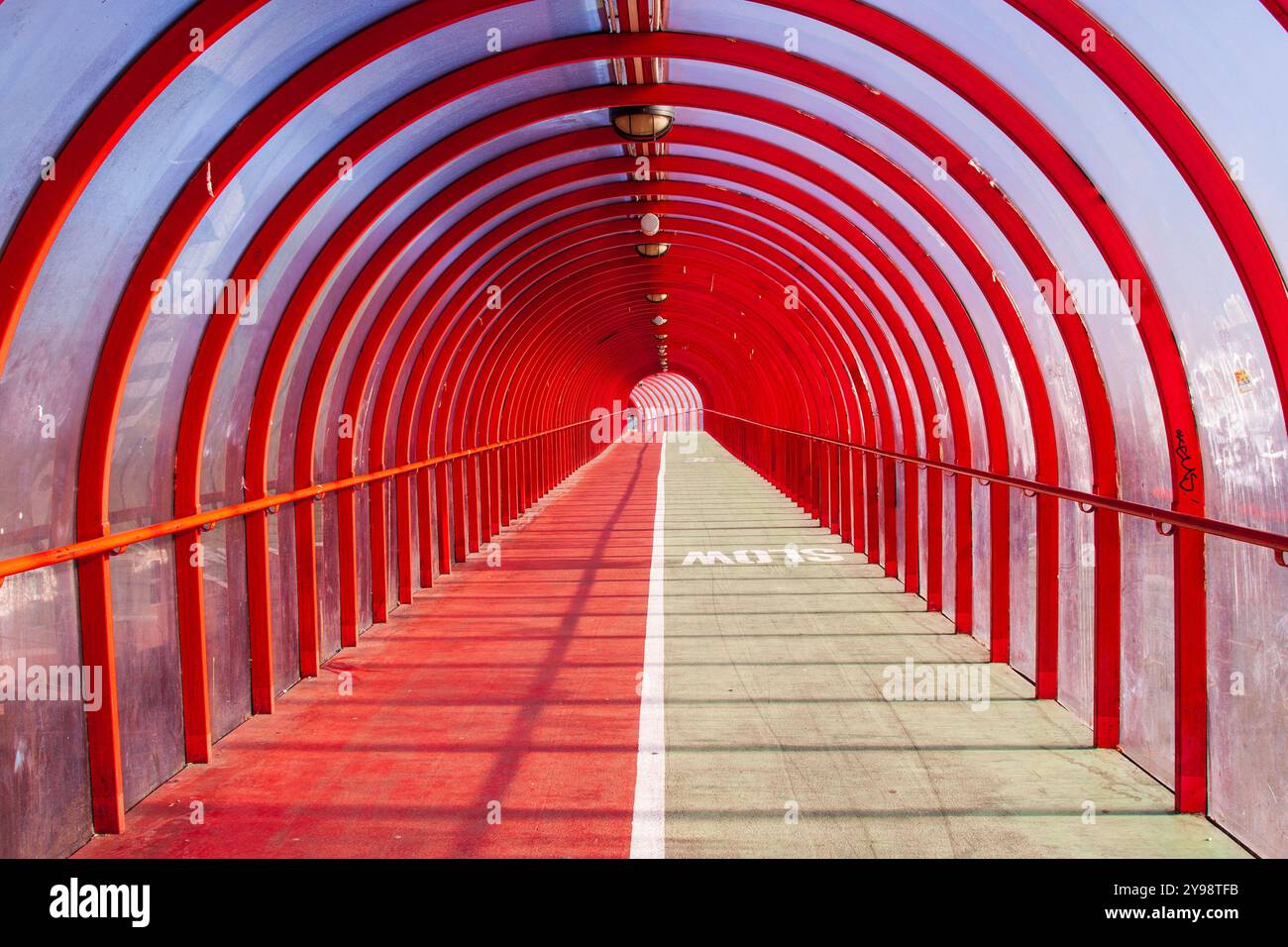 Bright red tunnel walkway for pedestrians between Scottish Exhibition ...