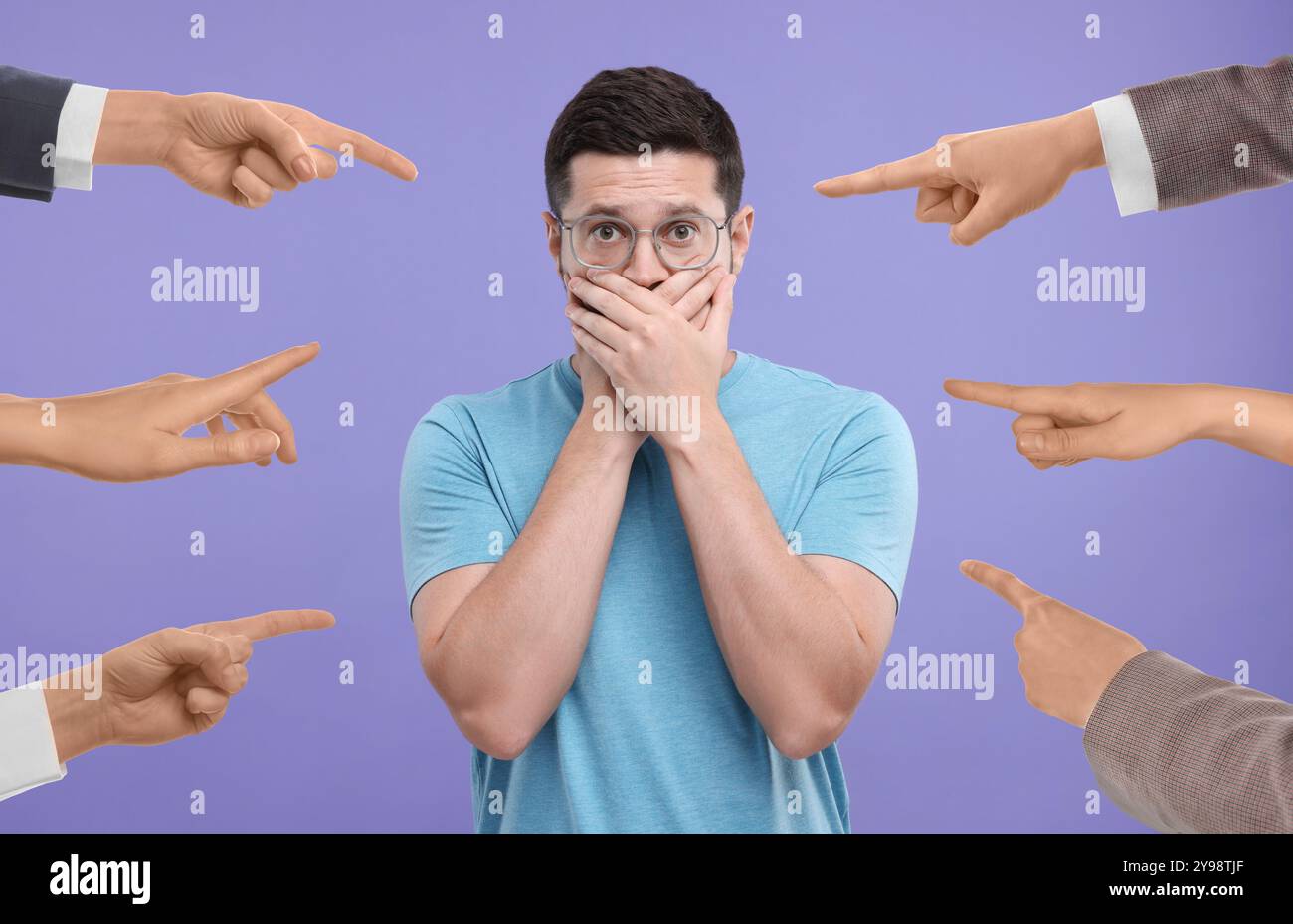 People pointing at embarrassed man on violet background Stock Photo - Alamy