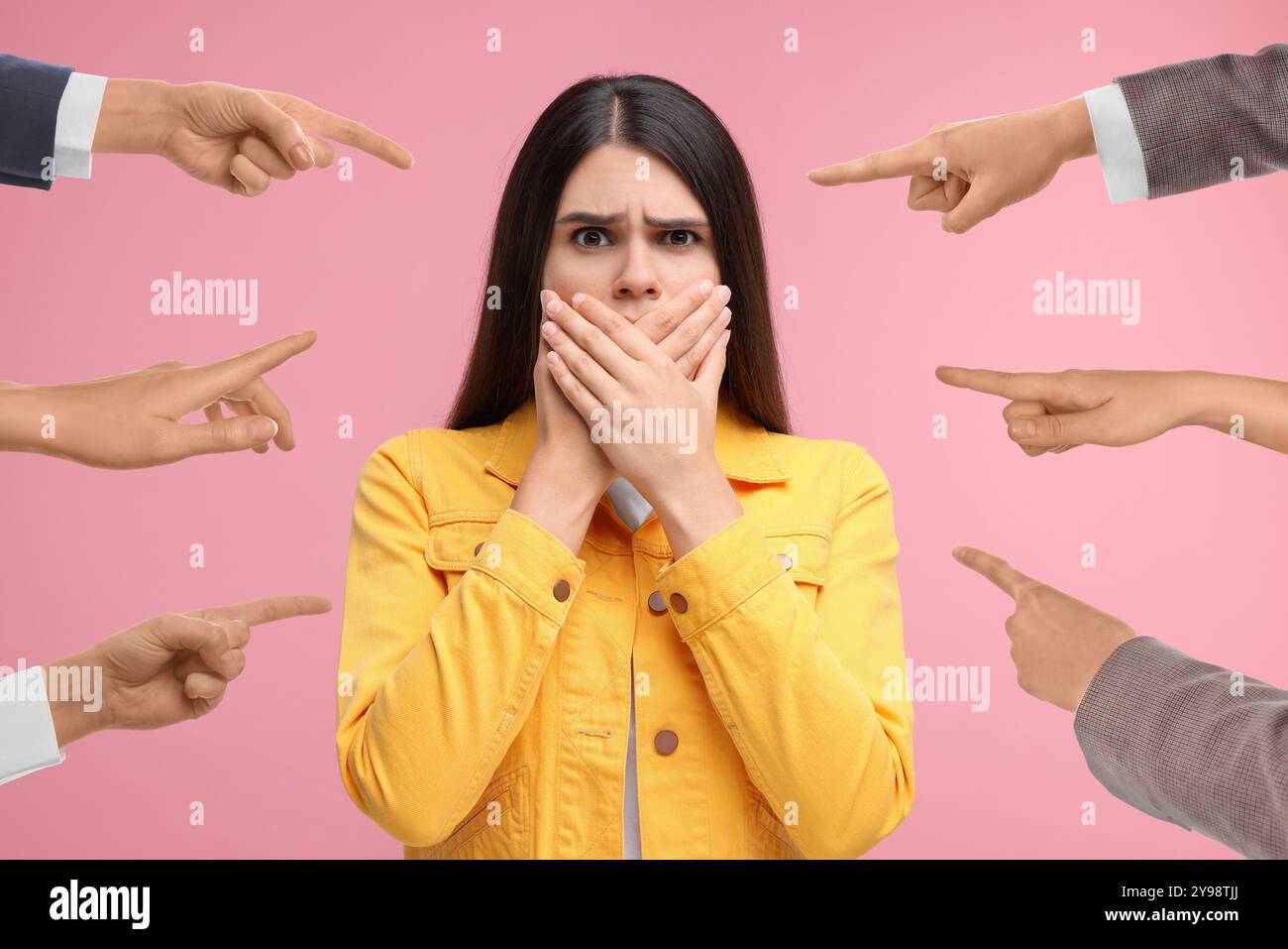 People pointing at embarrassed woman on pink background Stock Photo - Alamy