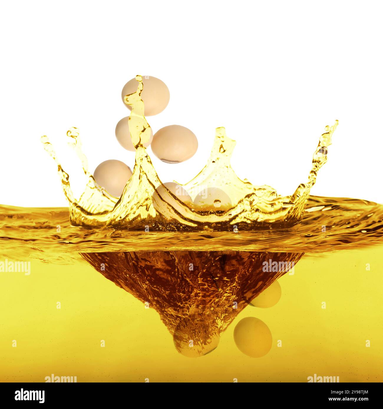 Soy beans falling into vegetable oil on white background Stock Photo ...