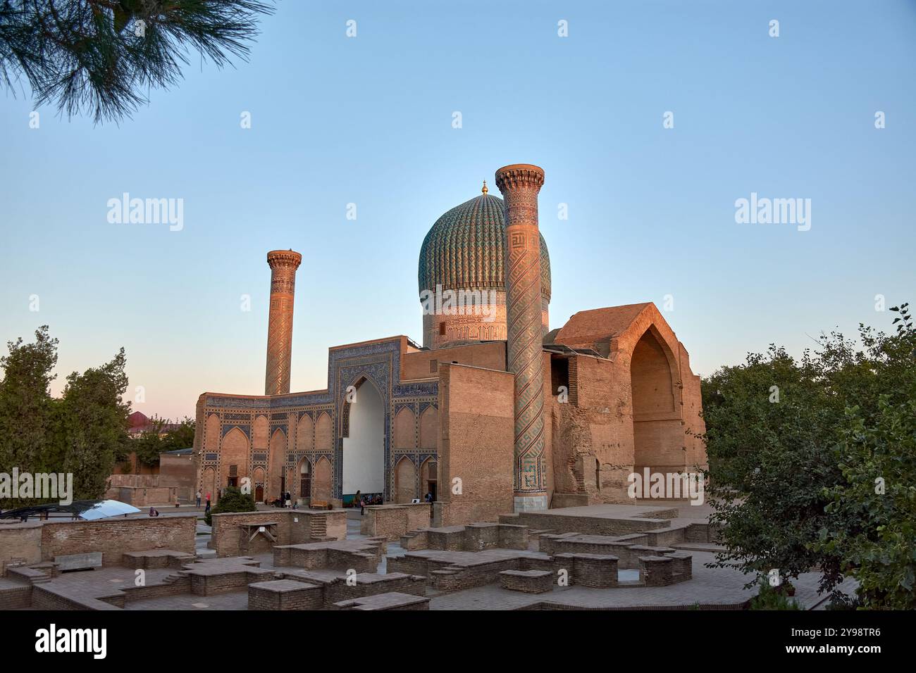 the magnificent blue dome and slender minarets of Gur-e-Amir Mausoleum ...
