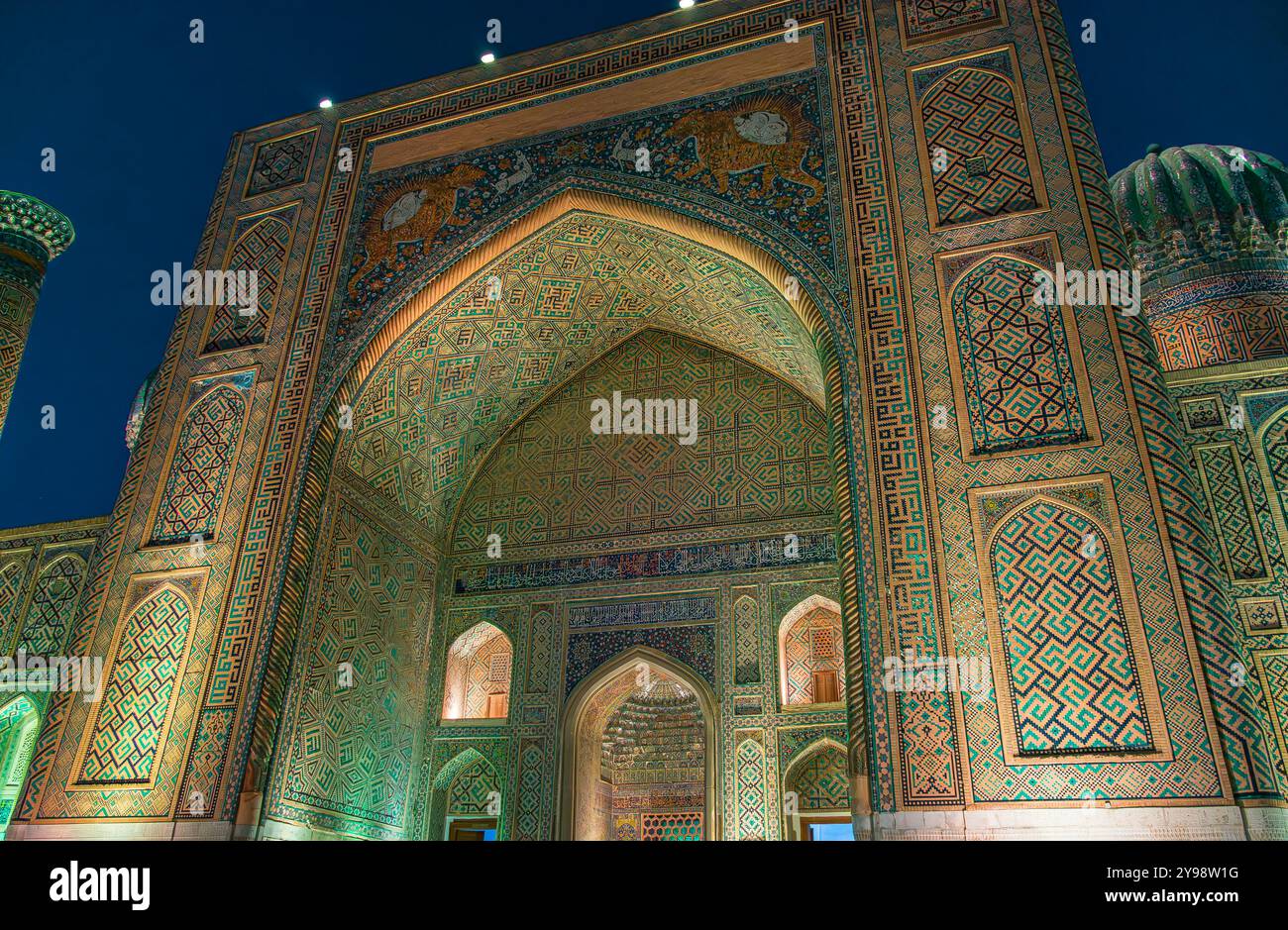 Registan Square in Samarkand, Uzbekistan, illuminated under the evening ...
