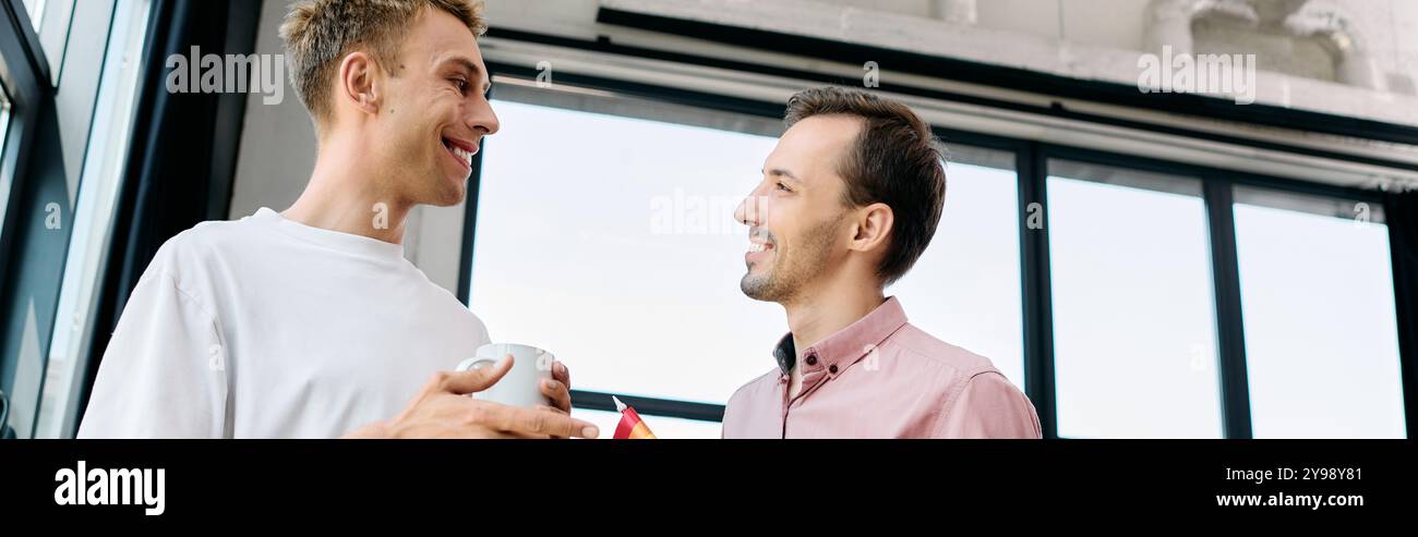 Two charming men enjoy a heartfelt conversation, sipping drinks in a ...