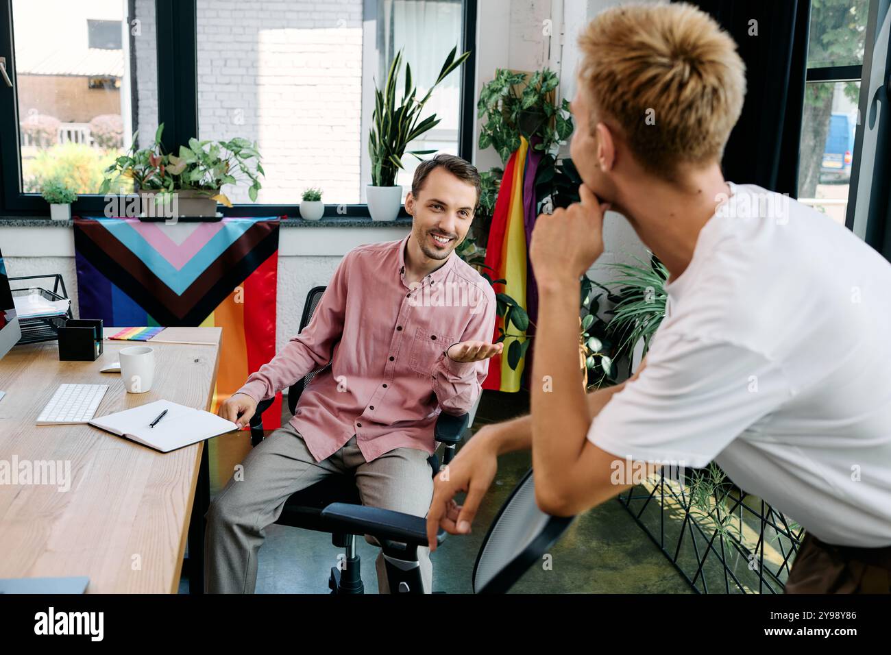 Two men in vibrant attire engage in hi-res stock photography and images ...