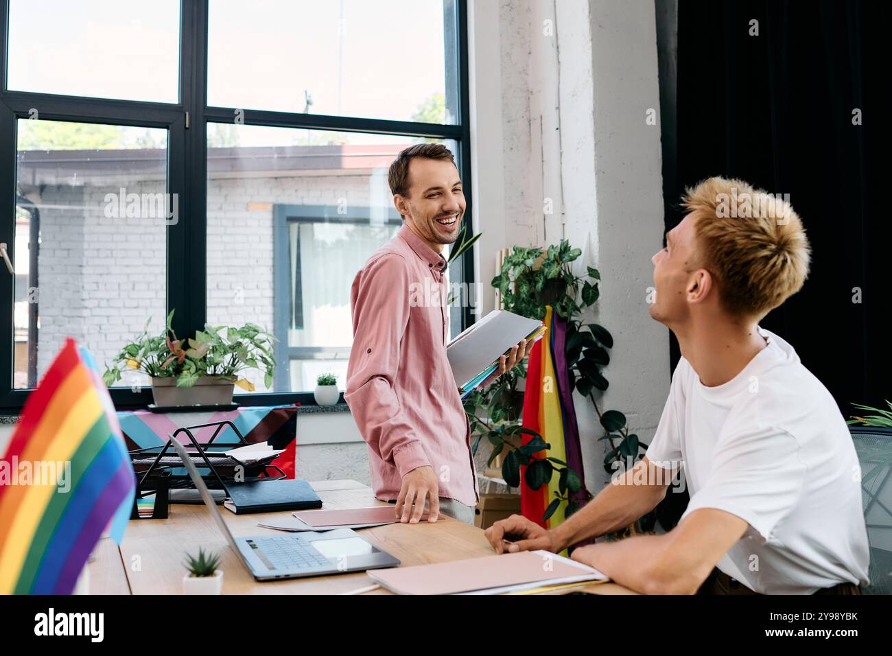 Two joyful partners share laughter and conversation in their vibrant ...