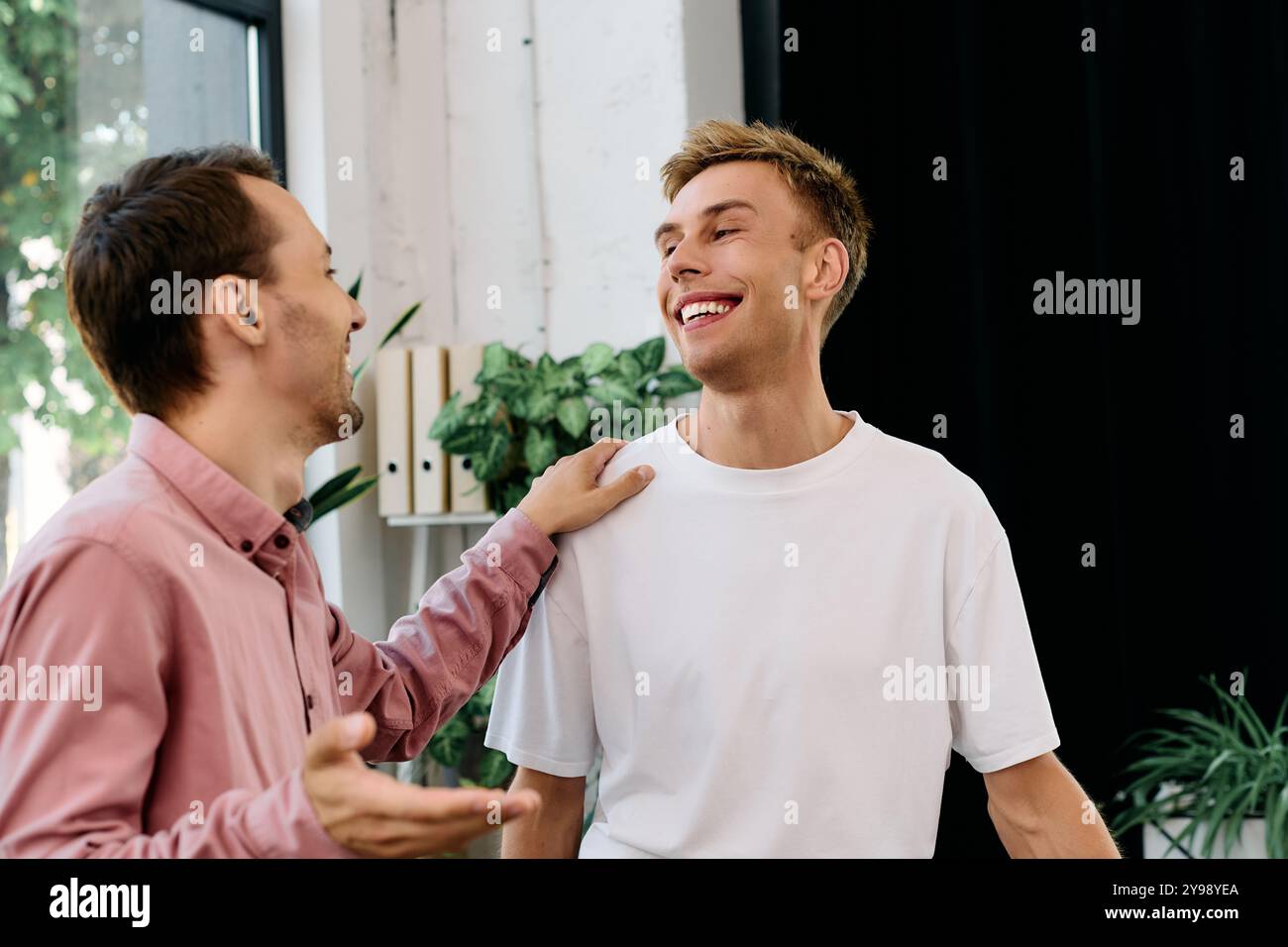 A handsome couple shares laughter and embraces, celebrating their ...